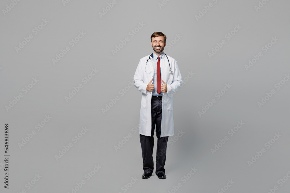 Full body male doctor confident cheerful smiling man wearing white ...