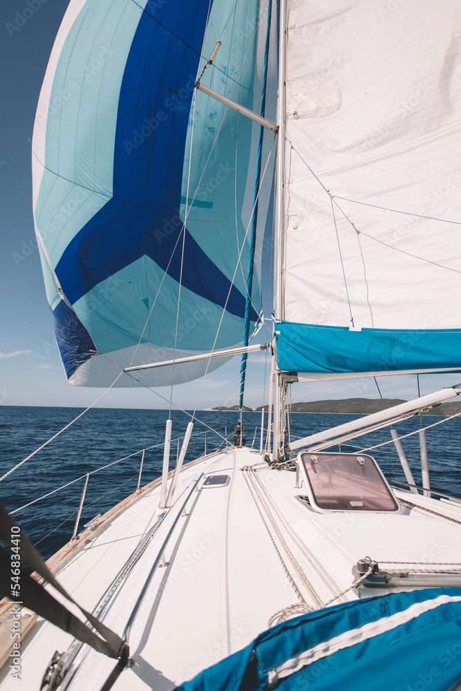 Sailboat with spinnaker sail opened Stock Photo | Adobe Stock