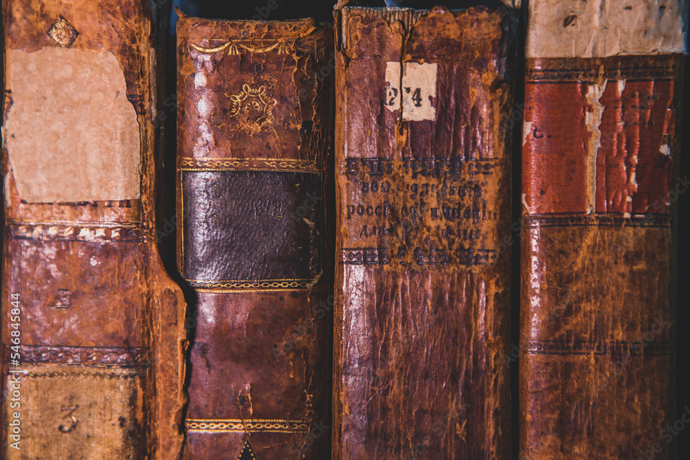 Very old books sitting on the shelves in the library. Books as a symbol ...