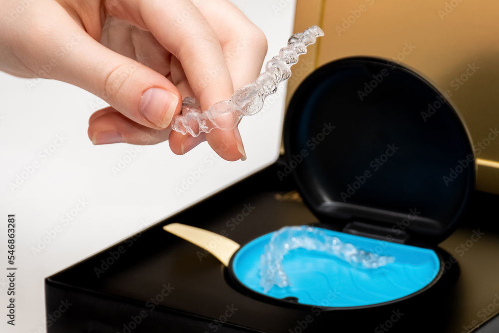 Transparent teeth aligners in a box. Invisible braces. Clear teeth ...