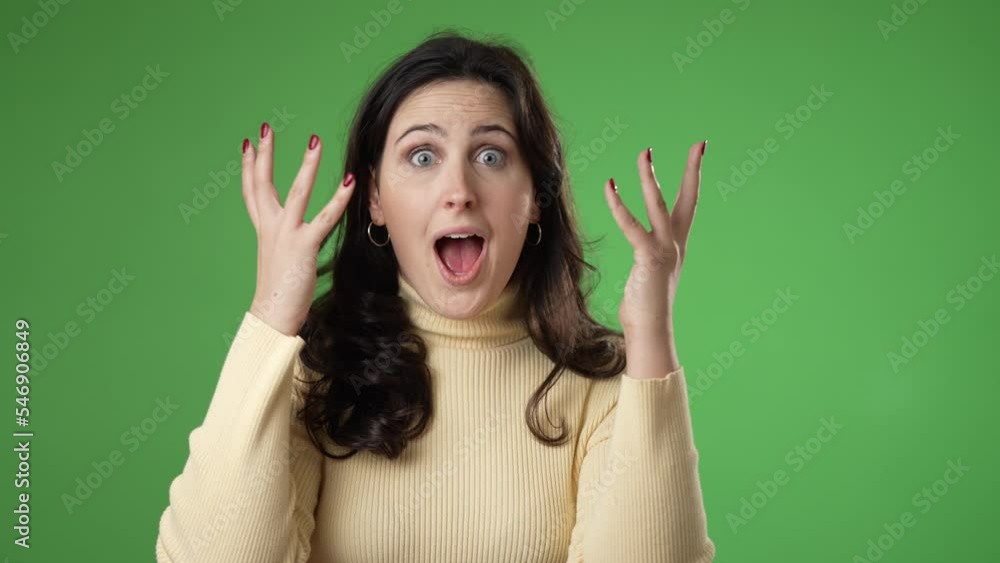 Slow motion portrait of excited, surprised smiling pretty young hipster ...