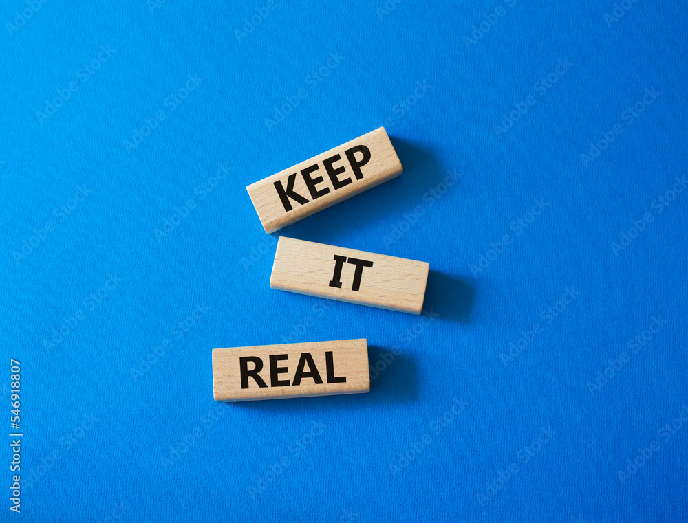 Keep it real symbol. Concept word Keep it real on wooden blocks ...