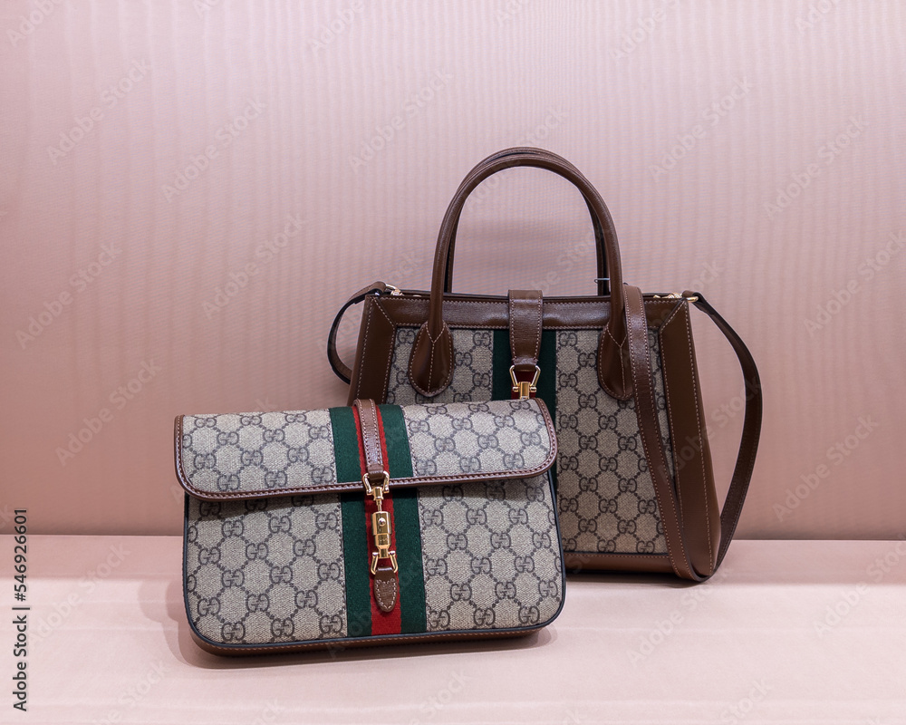 Two Gucci Handbags on Display at a Gucci Store. Gucci is an Italian ...