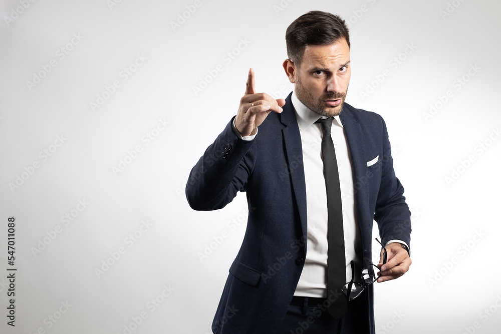 Forman dressed business man looking angry, studio portrait, portrait on ...