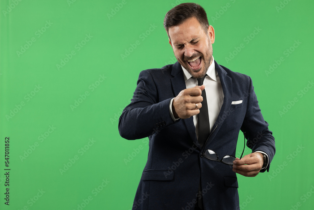 Young business man dressed in formal suit acting angry, and worried ...