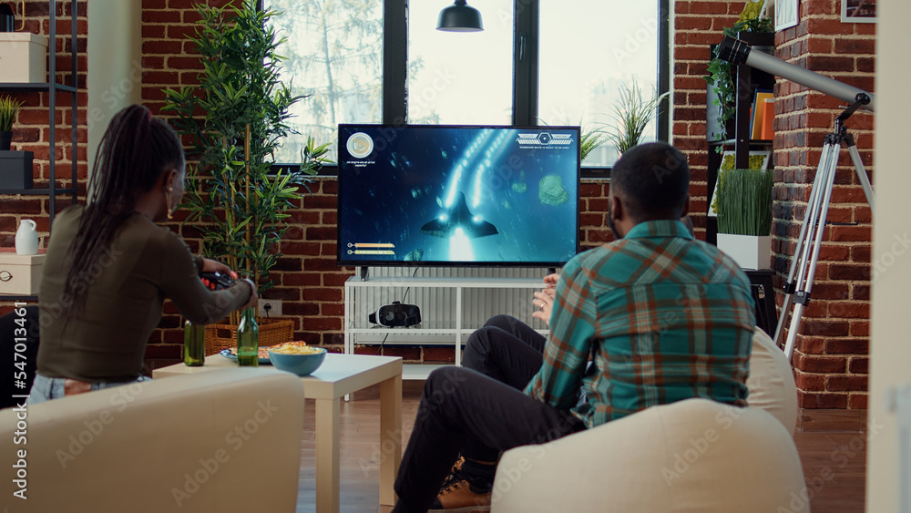 Diverse people having fun with video games challenge, playing online ...