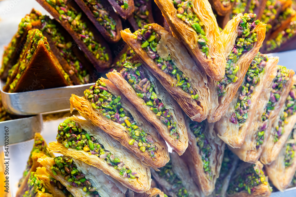 Sheets with delicious honey baklava with nuts on display of Turkish ...