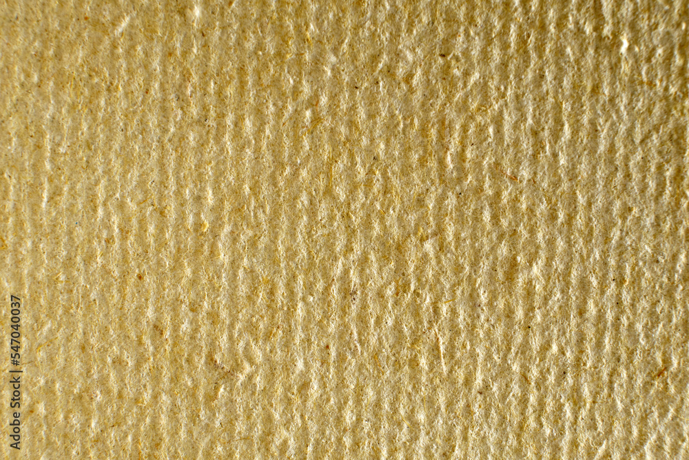 Close up section of handmade paper. Relief shadows on surface from side ...