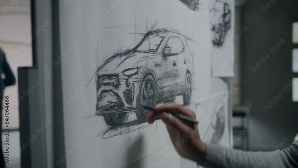 Automotive african american male designer drawing sketch blueprint with ...
