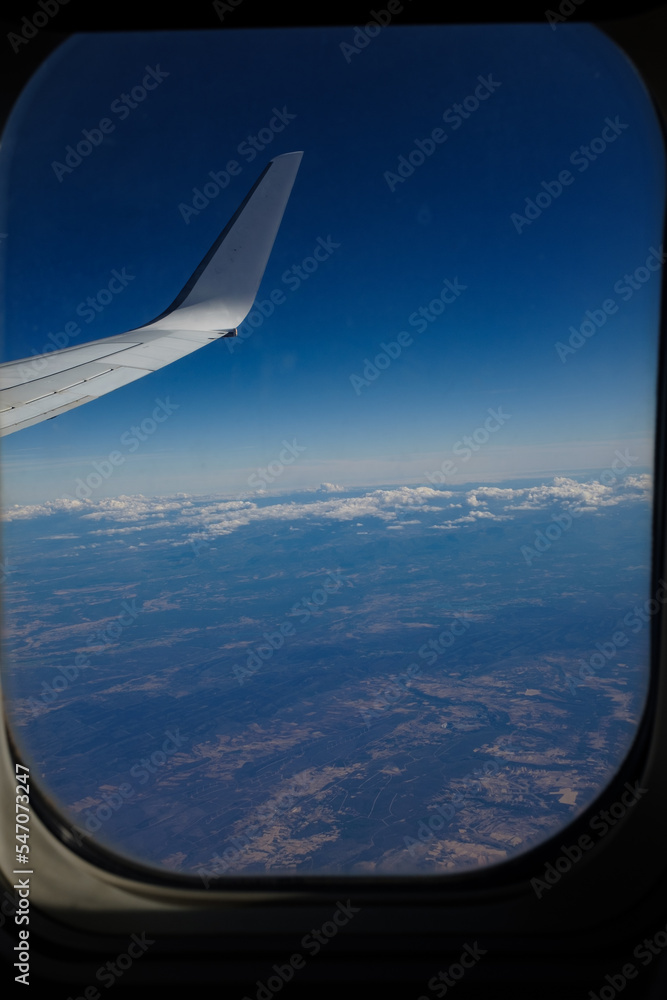 Airplane window frame silhouette on a beautiful sky landscape Stock ...
