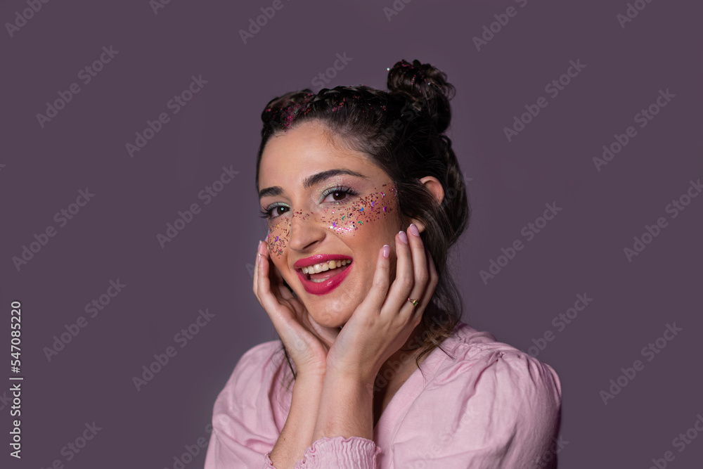 Headshot of lovely female model touches gently cheek, enjoys delicate ...