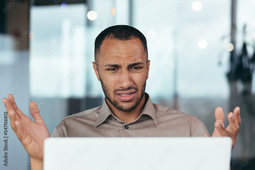 Upset businessman close up looking at laptop screen at work, man ...