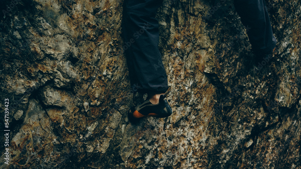 climber's feet while bouldering Stock Photo | Adobe Stock