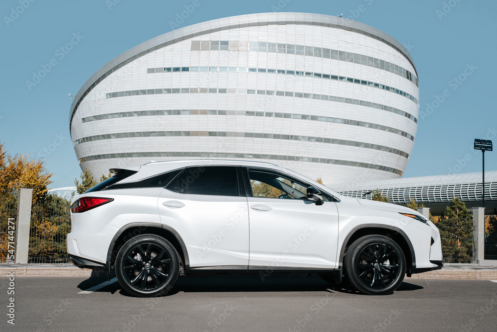 Lexus RX 300 on background of modern futuristic building outdoors. Side ...