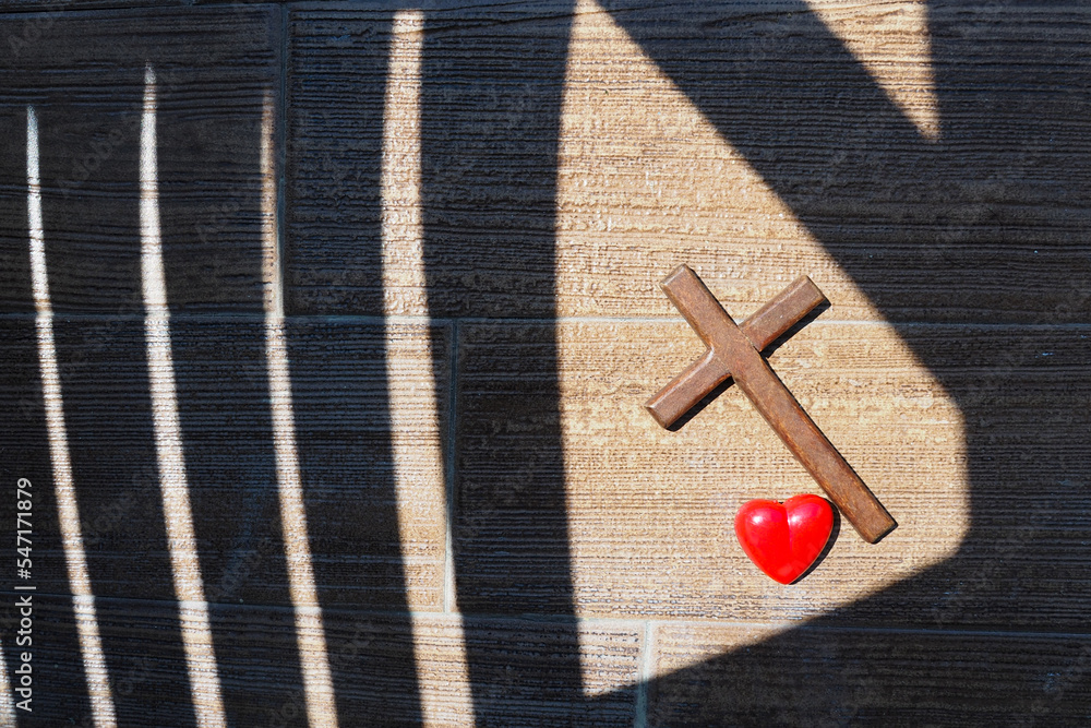 Red heart, wooden Jesus cross on tile. Concept Jesus loves you, Jesus ...