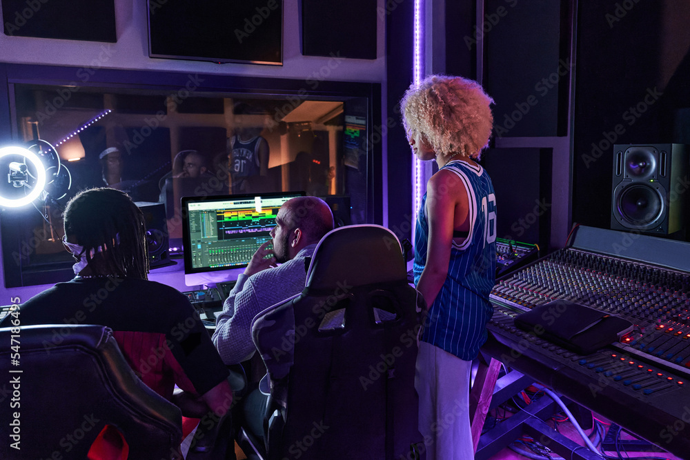 Group of multiethnic people working on music in recording studio Stock ...