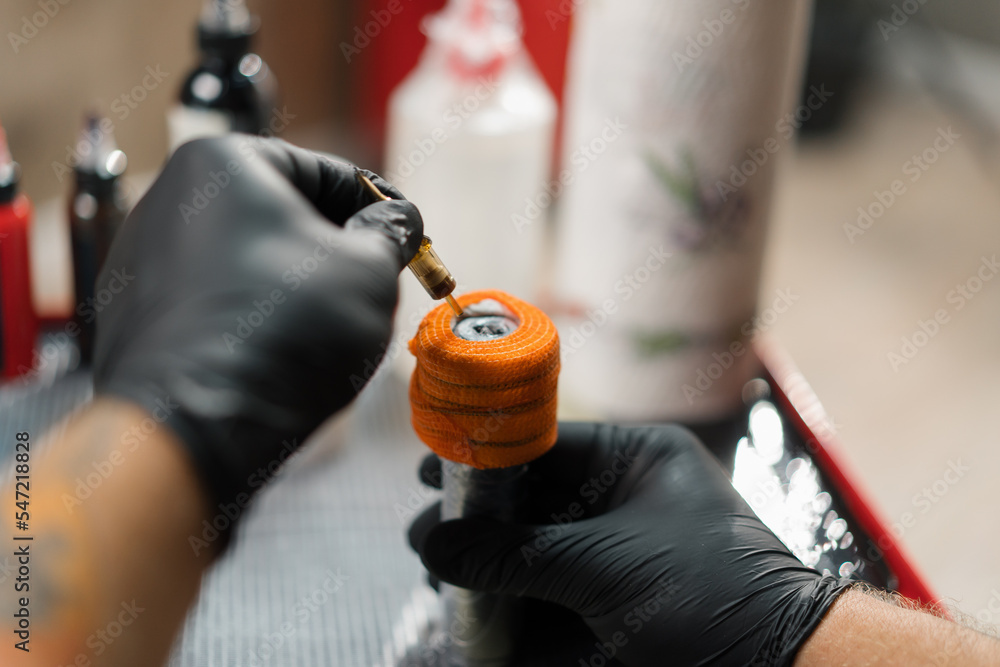 Tattoo artist collects tattoo washing machine. Tattoo needles Stock ...