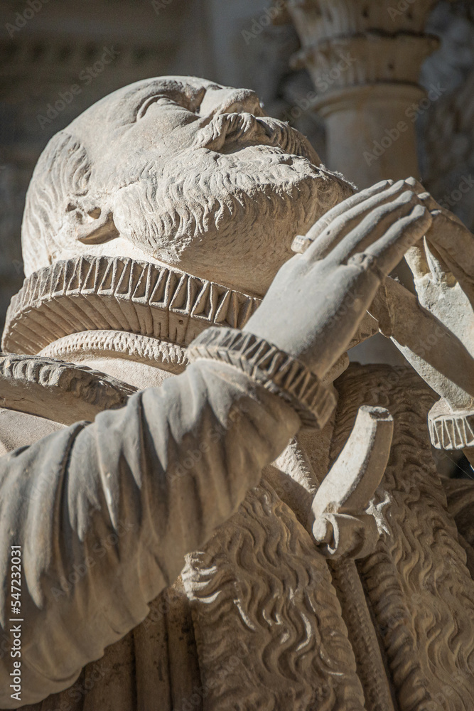 Ancient statue of a praying rich nobleman from middle age aristocracy ...