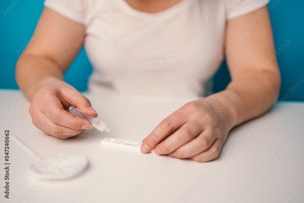 woman using rapid antigen test kit for self test COVID-19 epidemic at ...