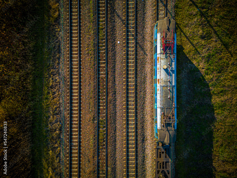 Aerial view of cargo train, a double-track railway in countryside ...