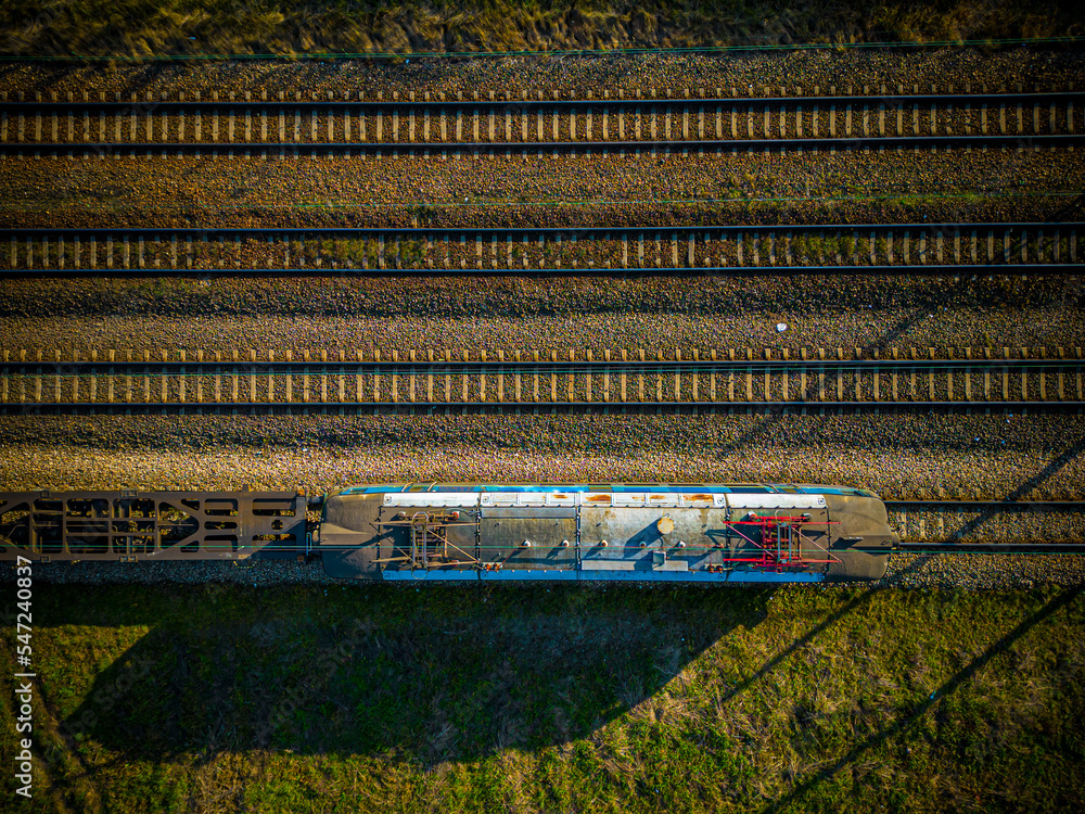 Aerial view of cargo train, a double-track railway in countryside ...