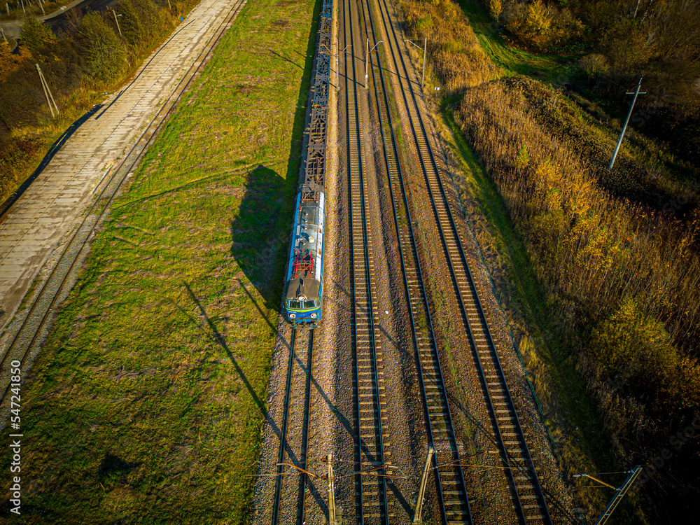 Aerial view of cargo train, a double-track railway in countryside ...