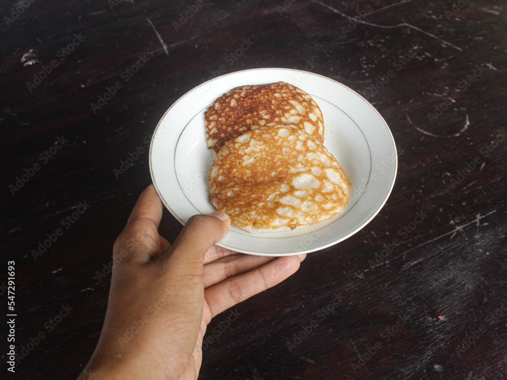 Serabi, a typical Indonesian pancake made from rice flour and coconut ...