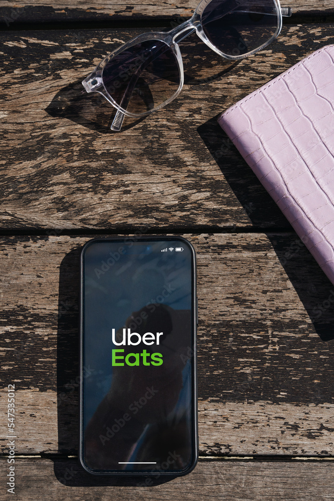 Uber Eats delivery app on the smartphone iPhone 14 Pro screen on the ...