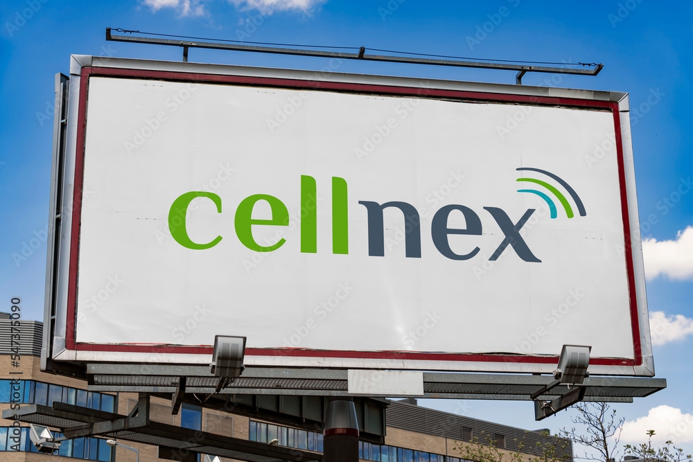 Advertisement billboard displaying logo of Cellnex Telecom Stock Photo ...