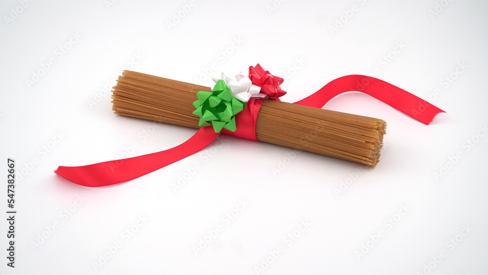 Spaghetti with red ribbon and colors of Italy's flag on an isolated ...