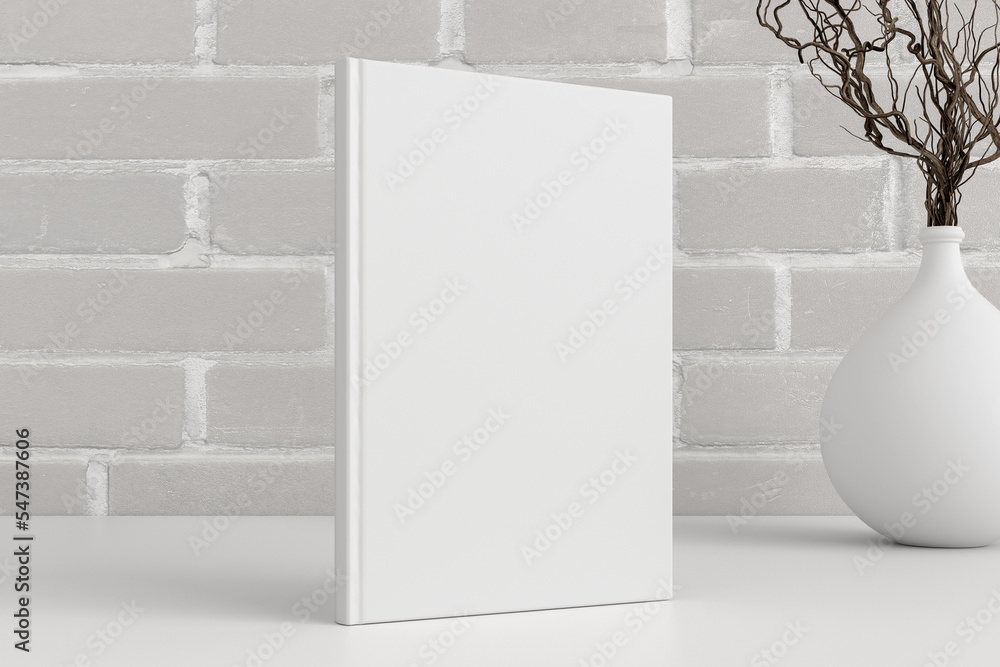 Vertical book cover mock up standing on a BBB desk with white brick ...