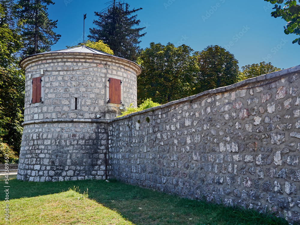 Wall and round tower of Biljarda, Billiard Palace, in Cetinje, the ...