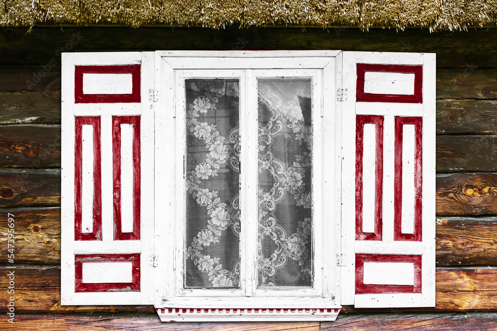 Wooden rustic window in small cottage house. Vintage red paint wall ...