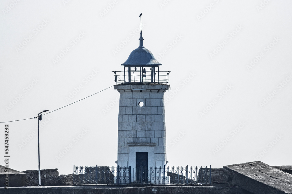 Poster The Genoese lighthouse stands tall and proud, a beacon of ...