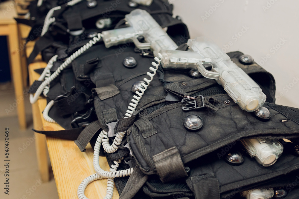 Weapons close-up on a military man standing inside the building and ...