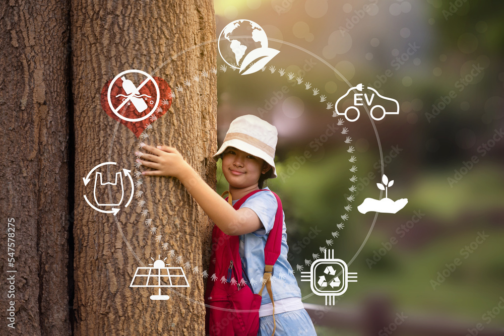 A girl hugging a large tree is a nature conservation concept. Raising ...
