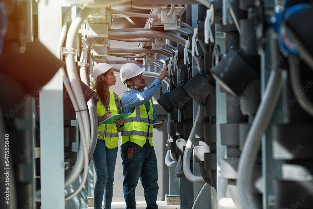 worker checking job in plant room. worker co-worker on Air condition ...
