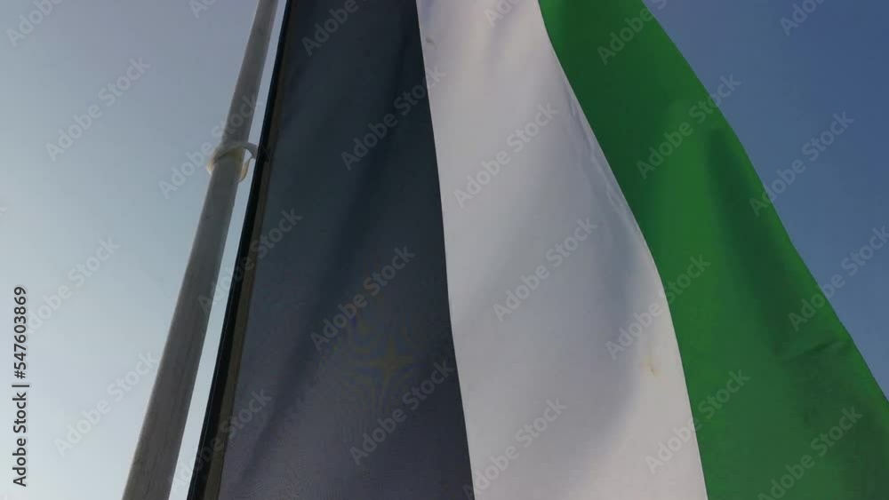 Low angle close view of United Arab Emirates national flag cloth fabric ...