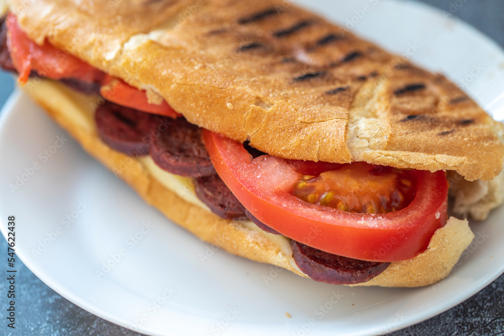 Turkish traditional toast sandwich, cheddar cheese, tomato, sausage ...