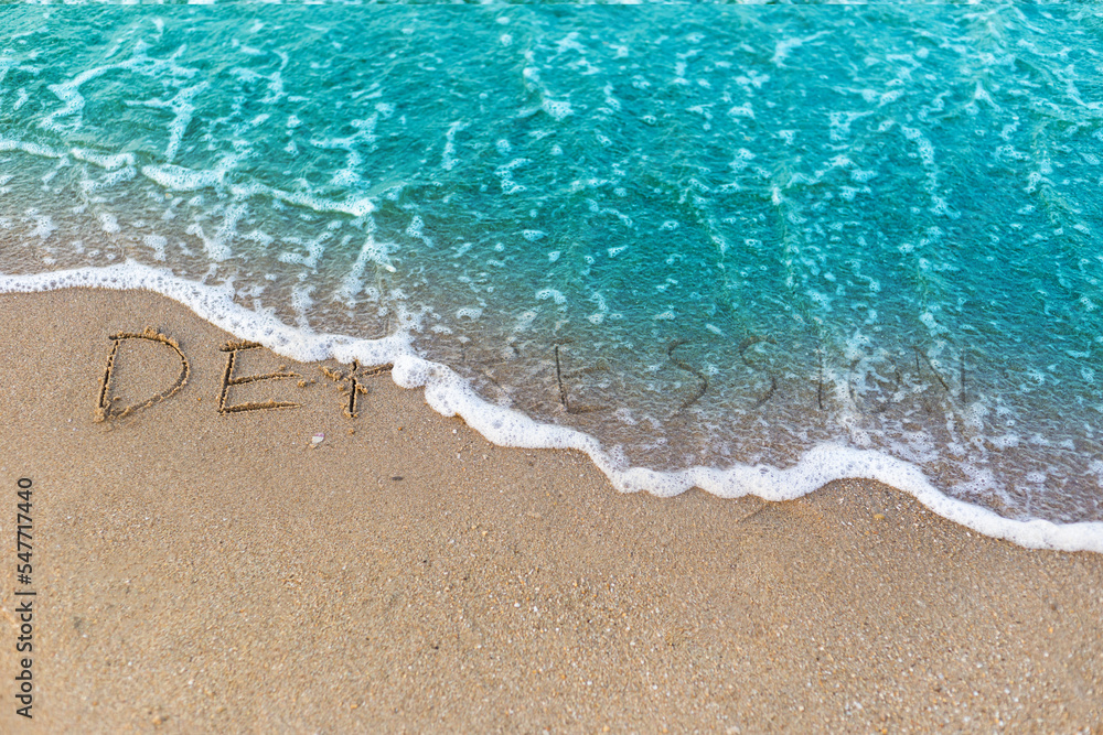 Wave wiping out handwritten on the beach. The word 'depression' written ...