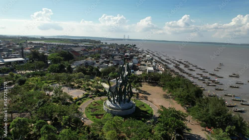 Aerial view of the A giant shark and crocodile statue as a symbol of ...
