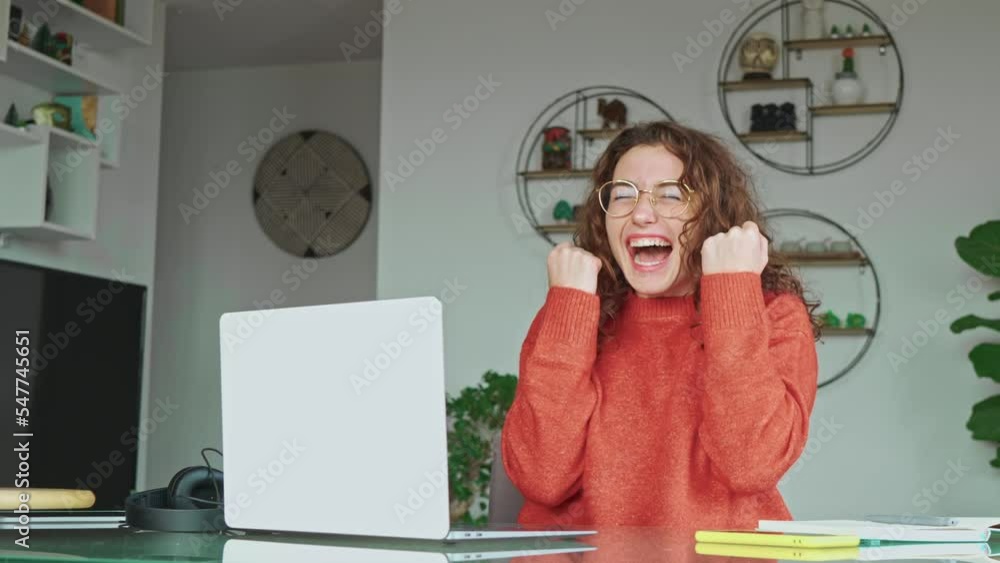 Happy girl student winner looking at laptop receiving good news in ...