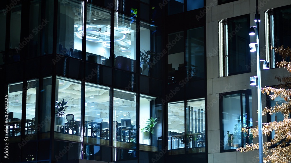 Modern office building in city at the night. View on illuminated ...