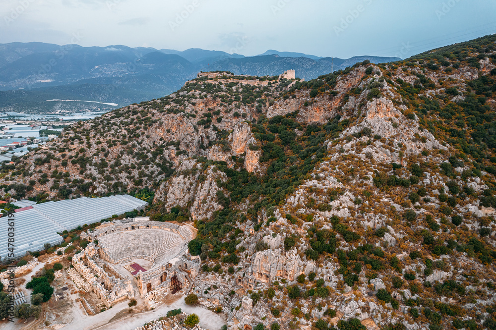 Aerial Top view Ancient lycian rock tomb ruins Myra in Demre Antalya, Turkey. Old tombs and ...
