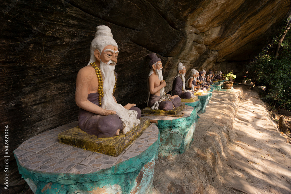 Cave temple in Thailand Asia with its stone statues one of the ancient ...
