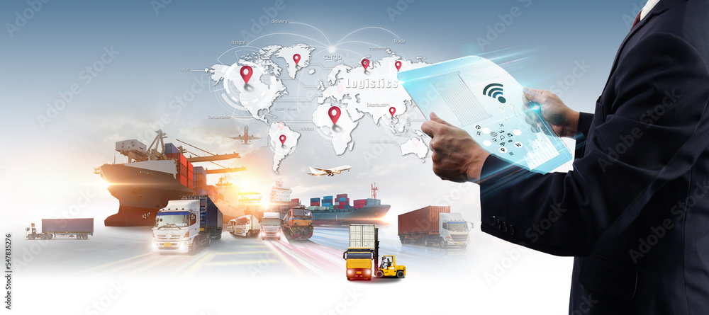 Businessman holding virtual interface panel of global logistics network ...