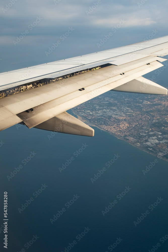 Flap wings opening on an aircraft wing while landing Stock Photo ...