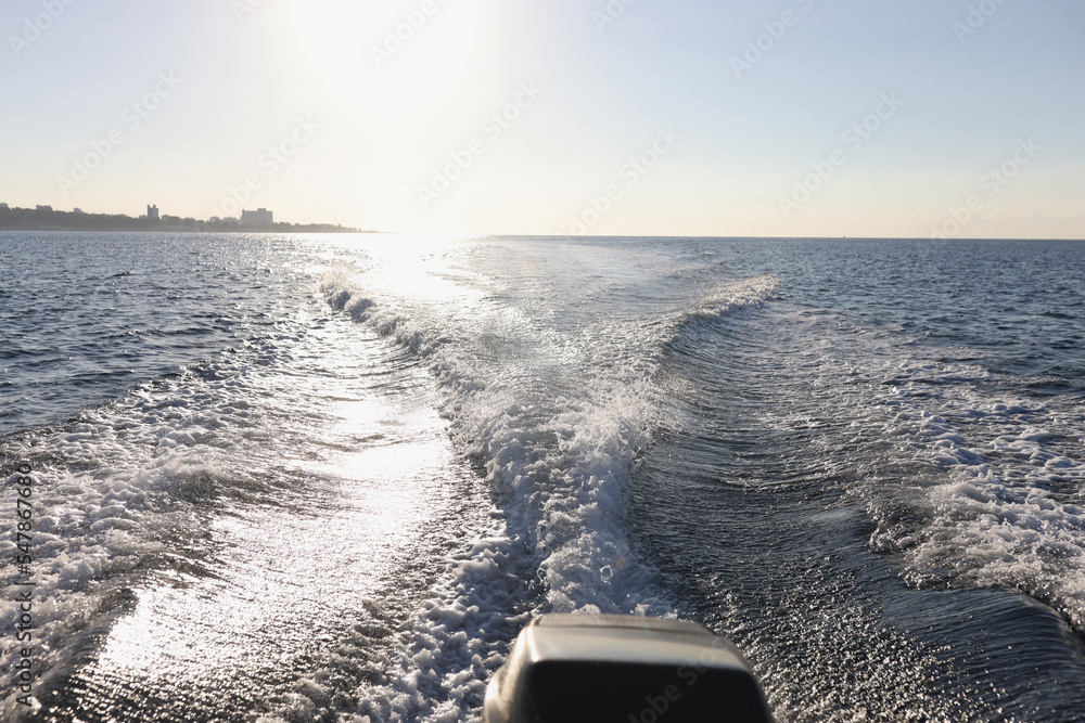 Outboard motor wake from cruising powerboat on sea Stock Photo | Adobe ...
