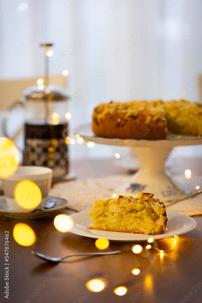 Peace of apple cake with streisel, apple cake on porcelain cake stand ...