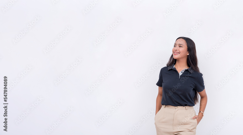 A pretty young Filipina intern in a black polo shirt and khaki pants ...